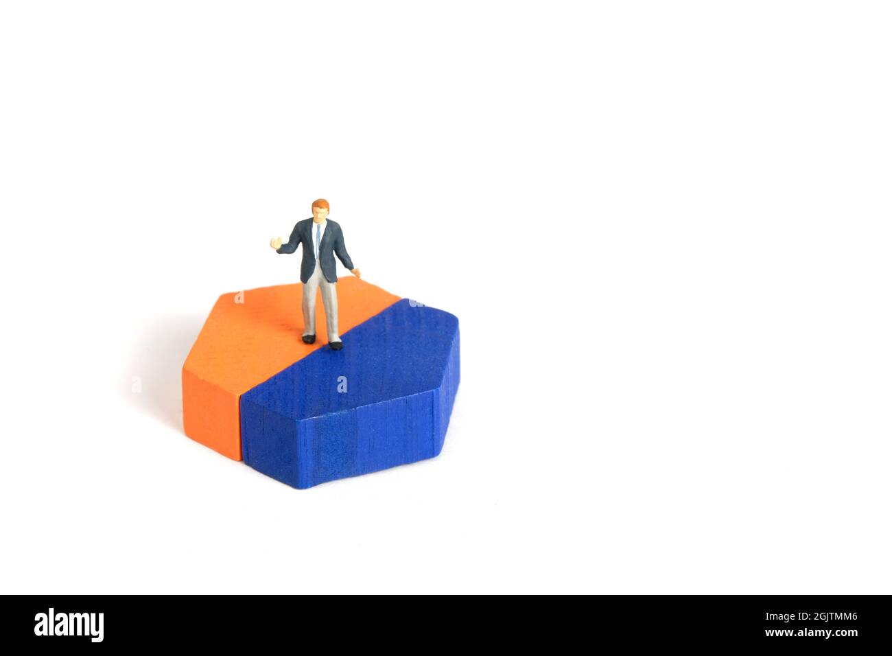 Miniature people toy figure photography. A shrugging businessman doing ...