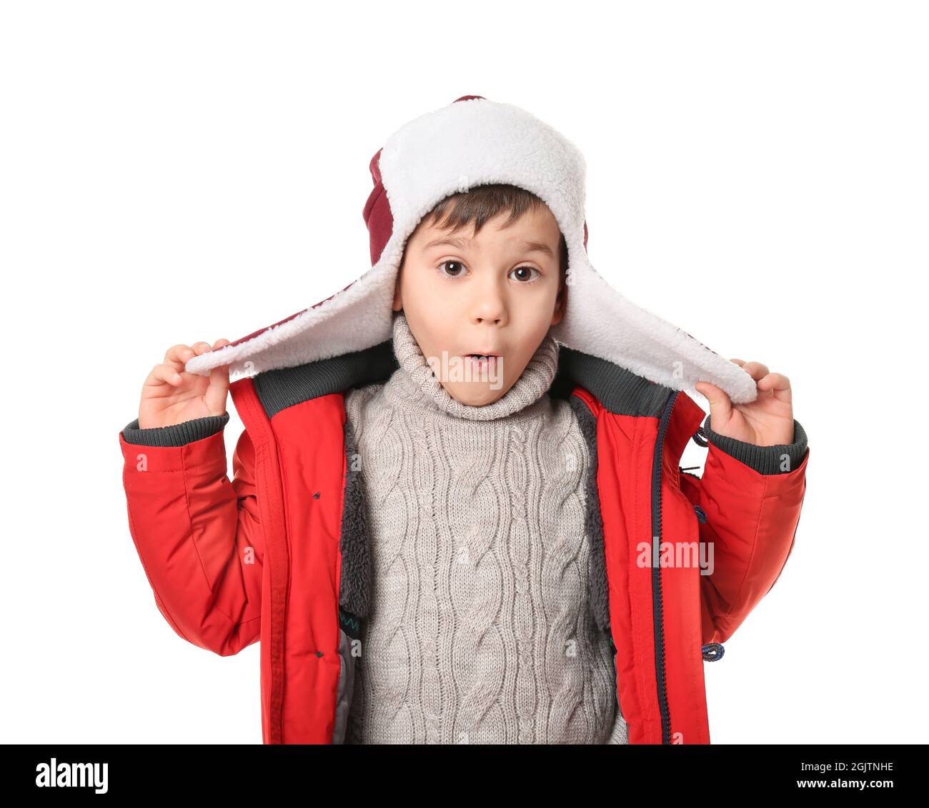 Cute little boy in warm clothes on white background Stock Photo - Alamy