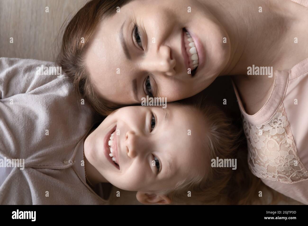 Close up portrait of bonding young mum and small kid Stock Photo - Alamy