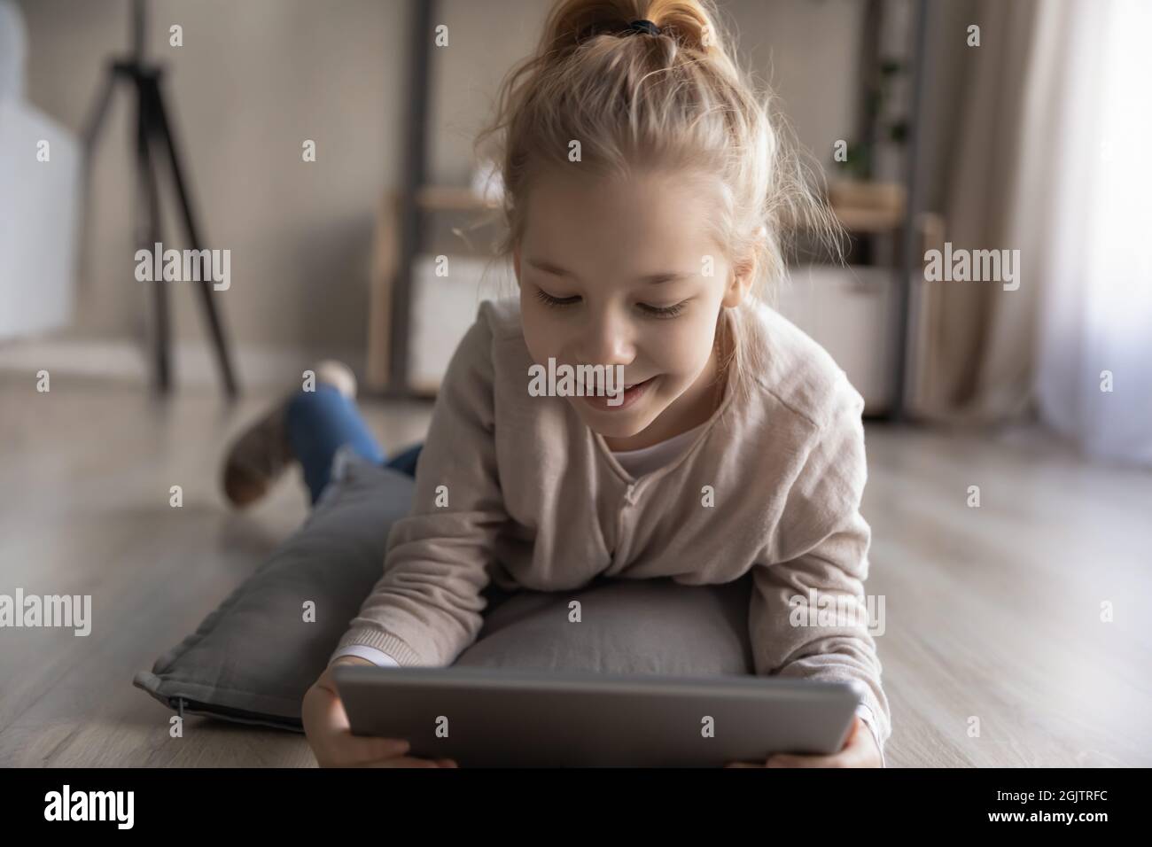 Happy adorable little child using digital computer tablet Stock Photo ...