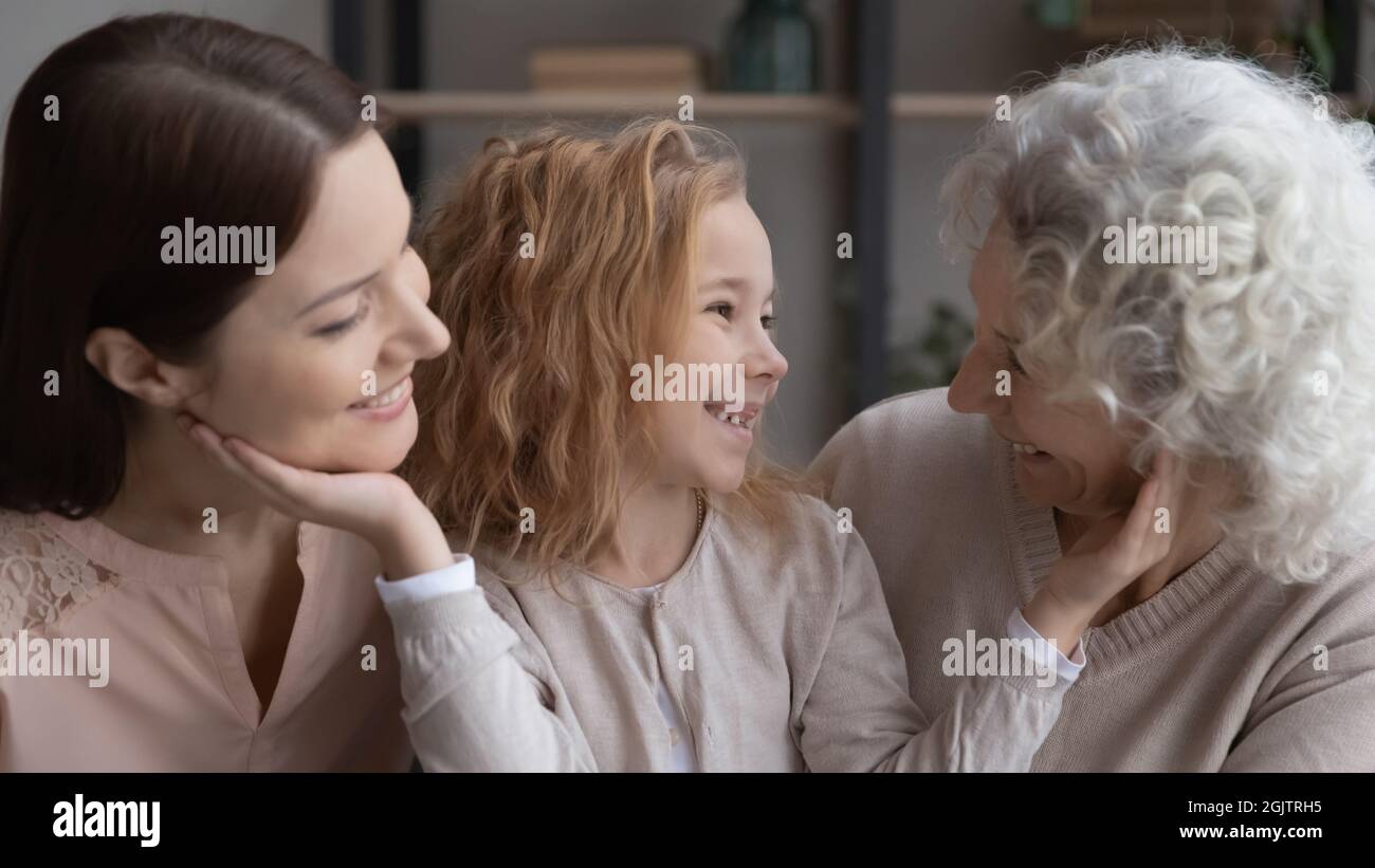 Happy three female generations family talking at home Stock Photo - Alamy