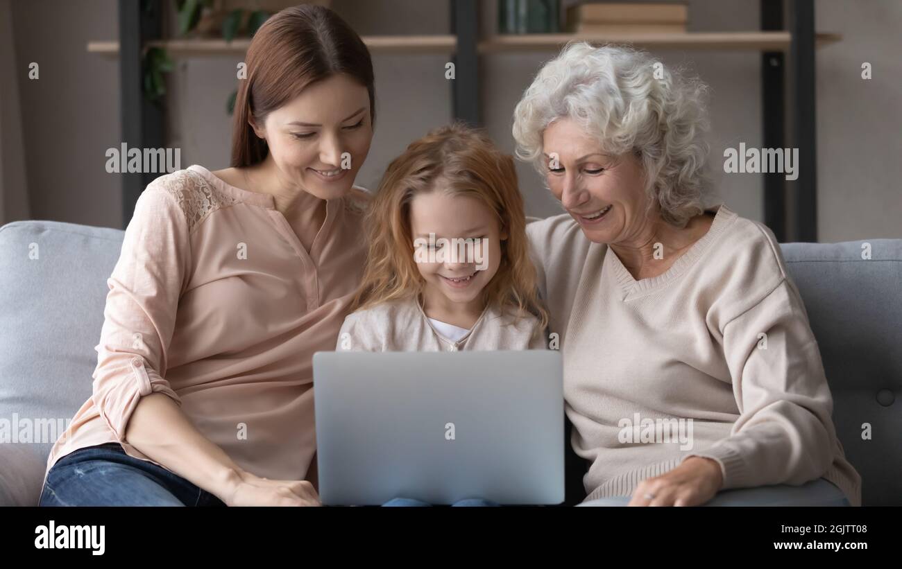Happy three generations family using computer at home Stock Photo - Alamy