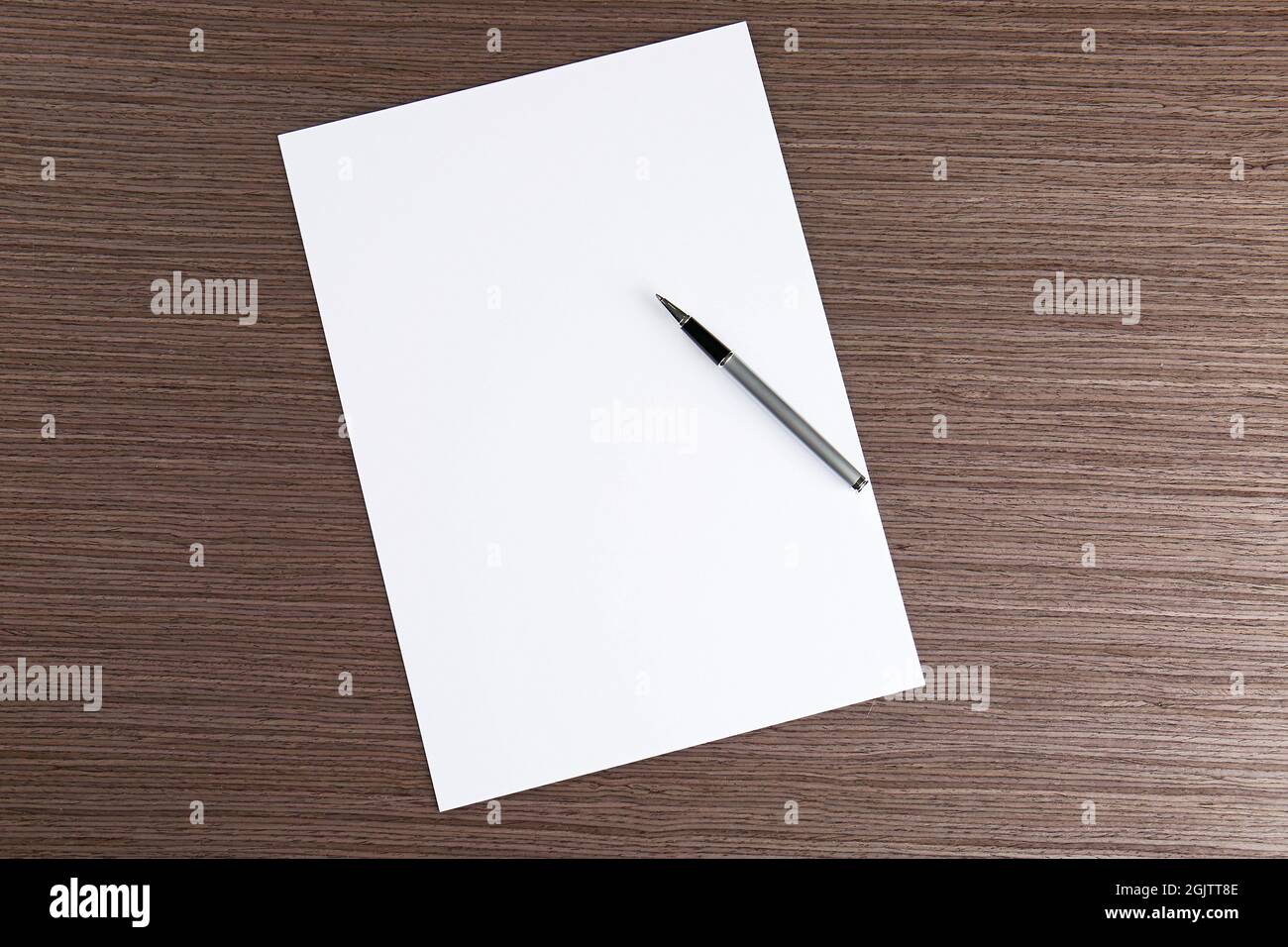 Empty paper sheet with pen on table. Job interview concept Stock Photo ...
