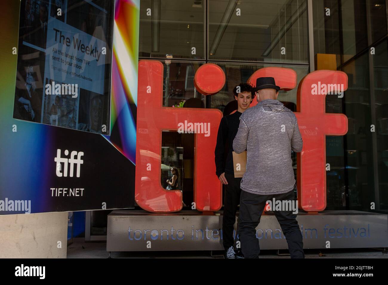 Toronto, Canada. 11th Sep, 2021. A man takes photos next to the TIFF ...