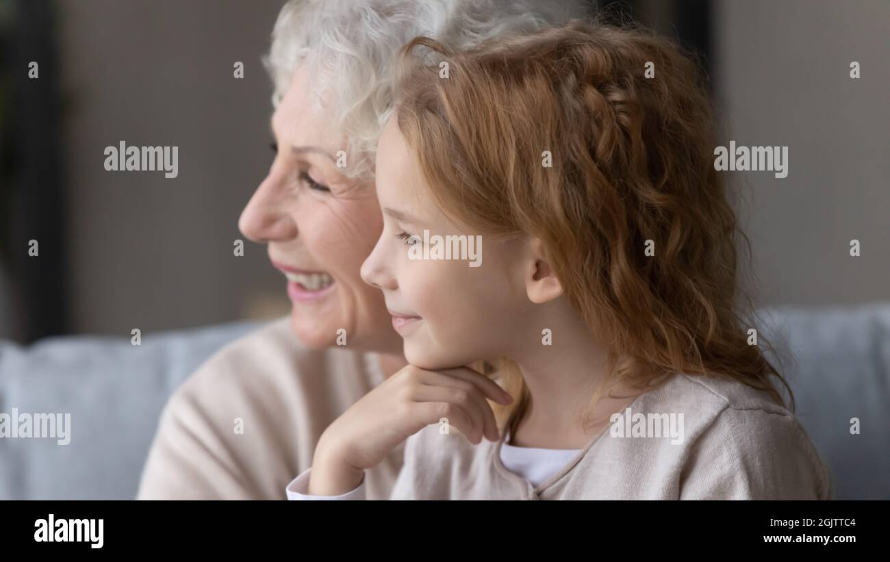 Bonding loving multigenerational family looking in distance Stock Photo ...