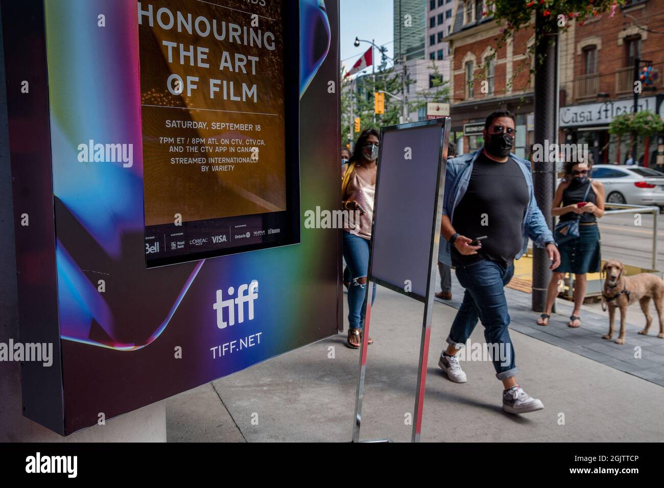 Toronto, Canada. 11th Sep, 2021. A man walks past the TIFF Bell Light ...