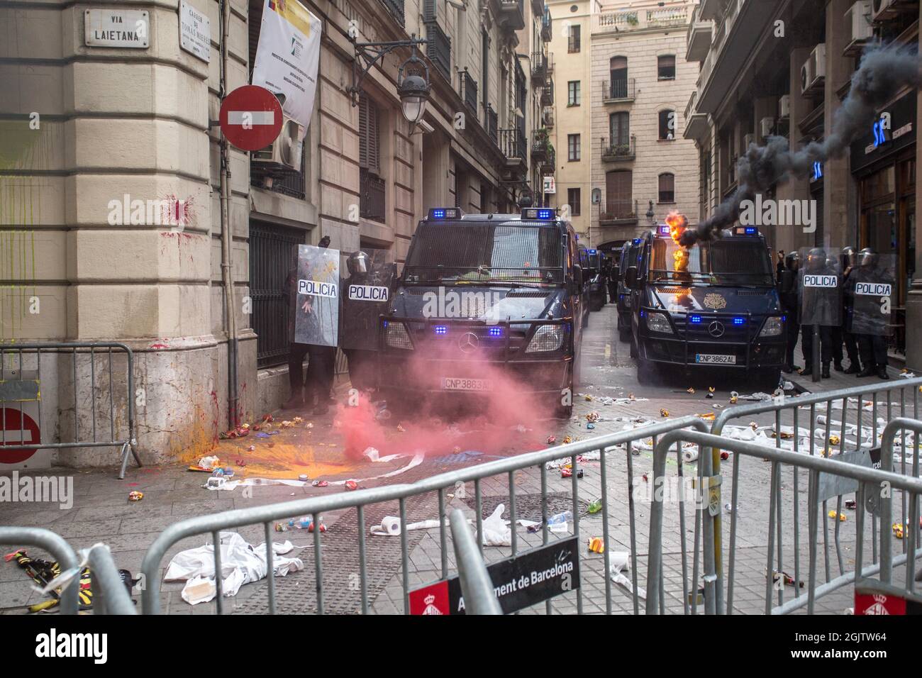 Fire flare is seen next to the police van during the demonstration of ...