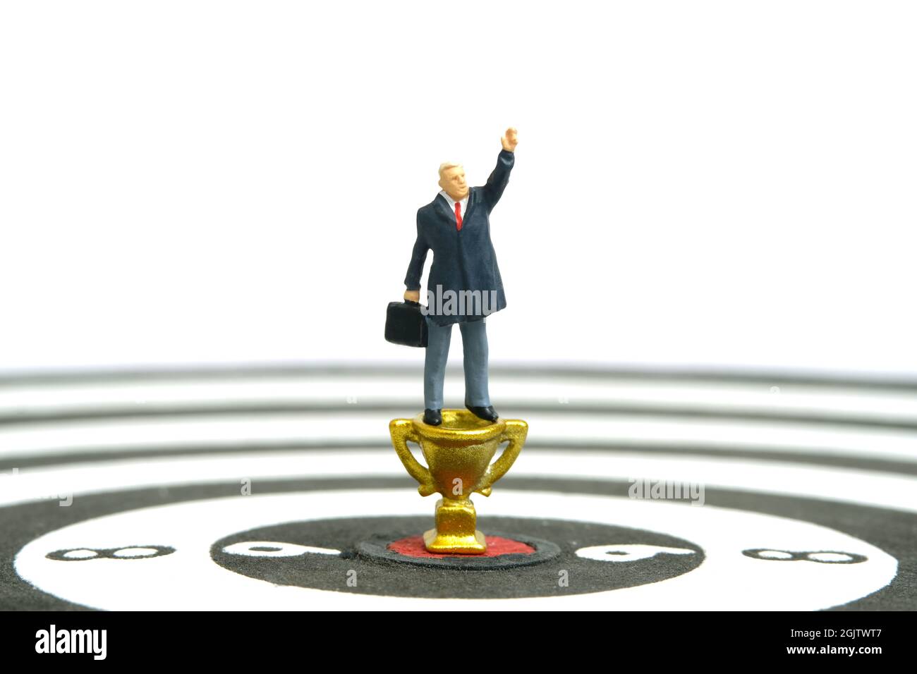 Miniature people toy figure photography. A determined businessman ...