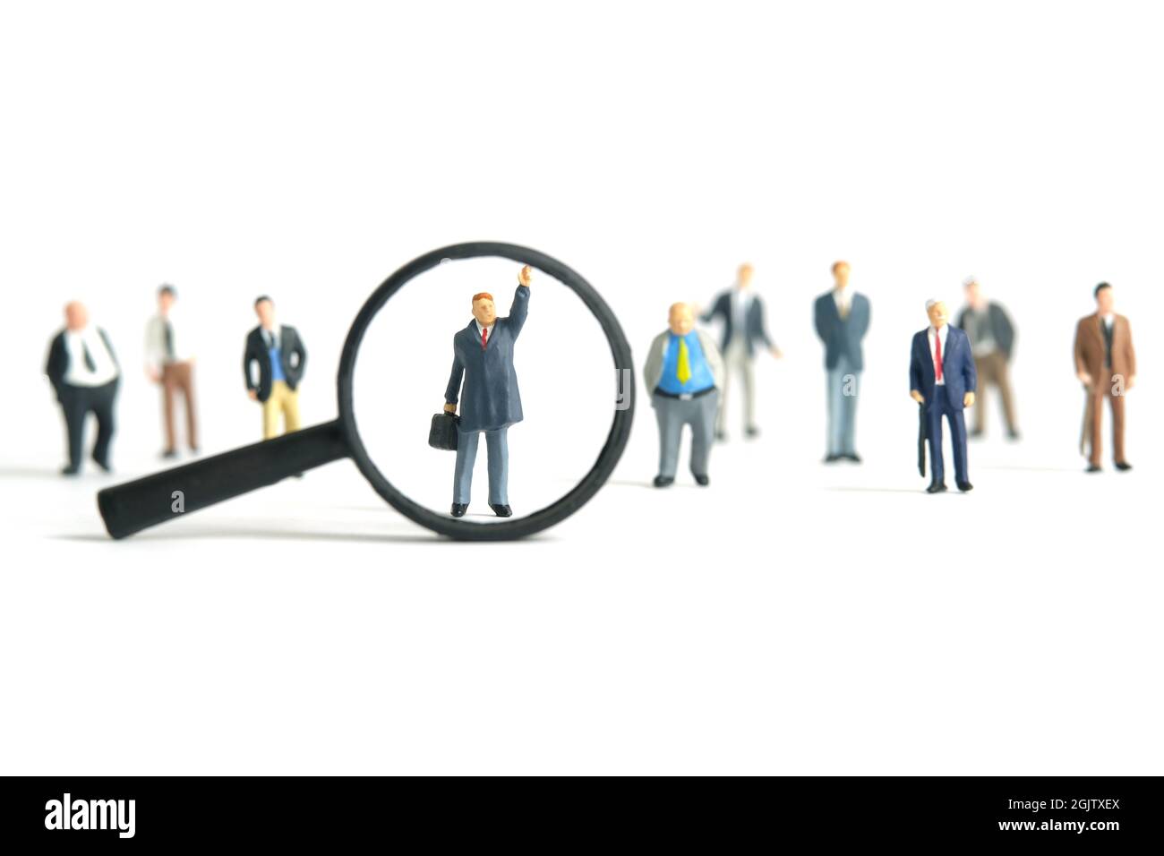 Miniature people toy figure photography. A businessman standing while ...