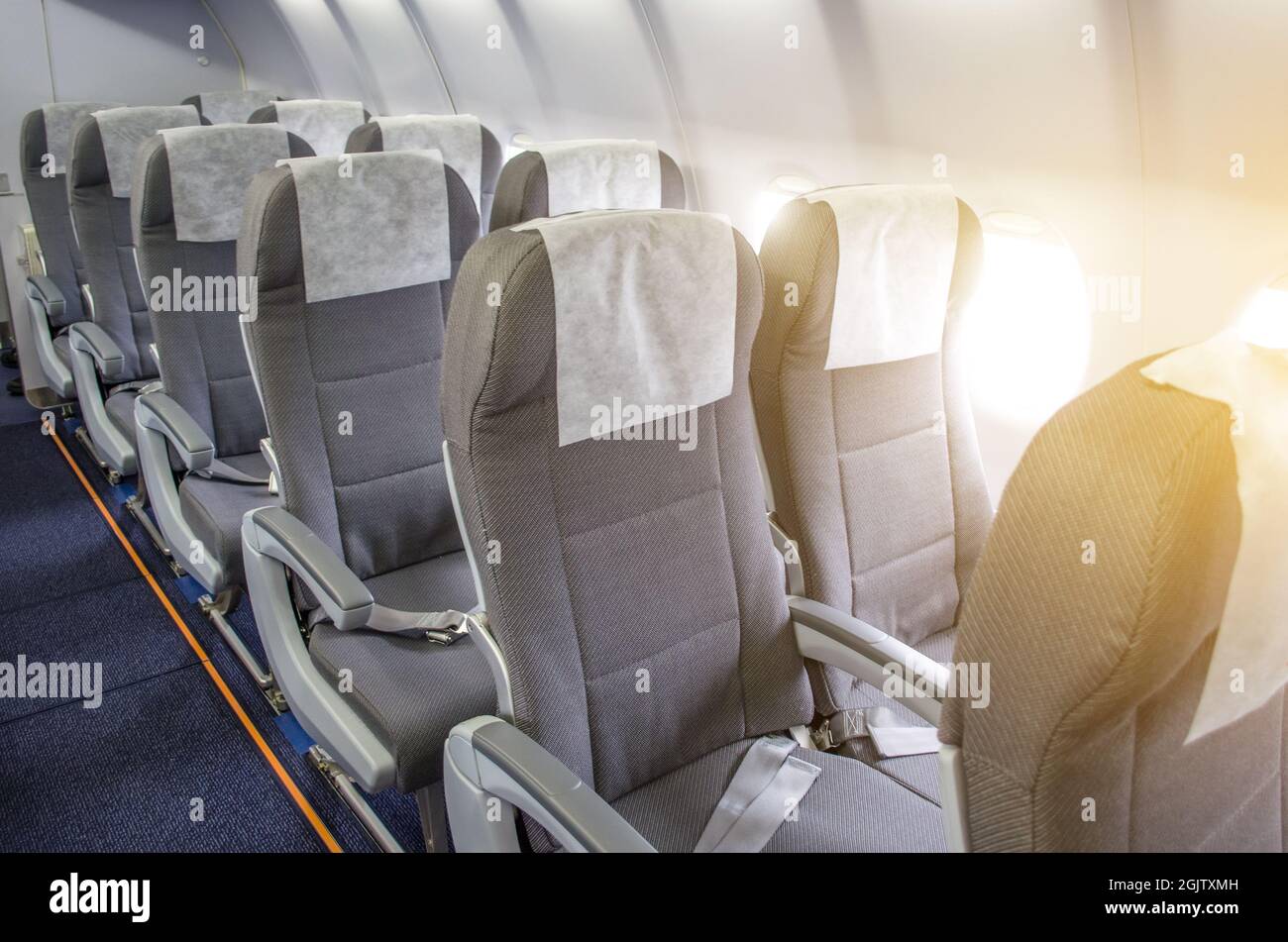 Rows of passenger seats in the cabin airplane Stock Photo - Alamy