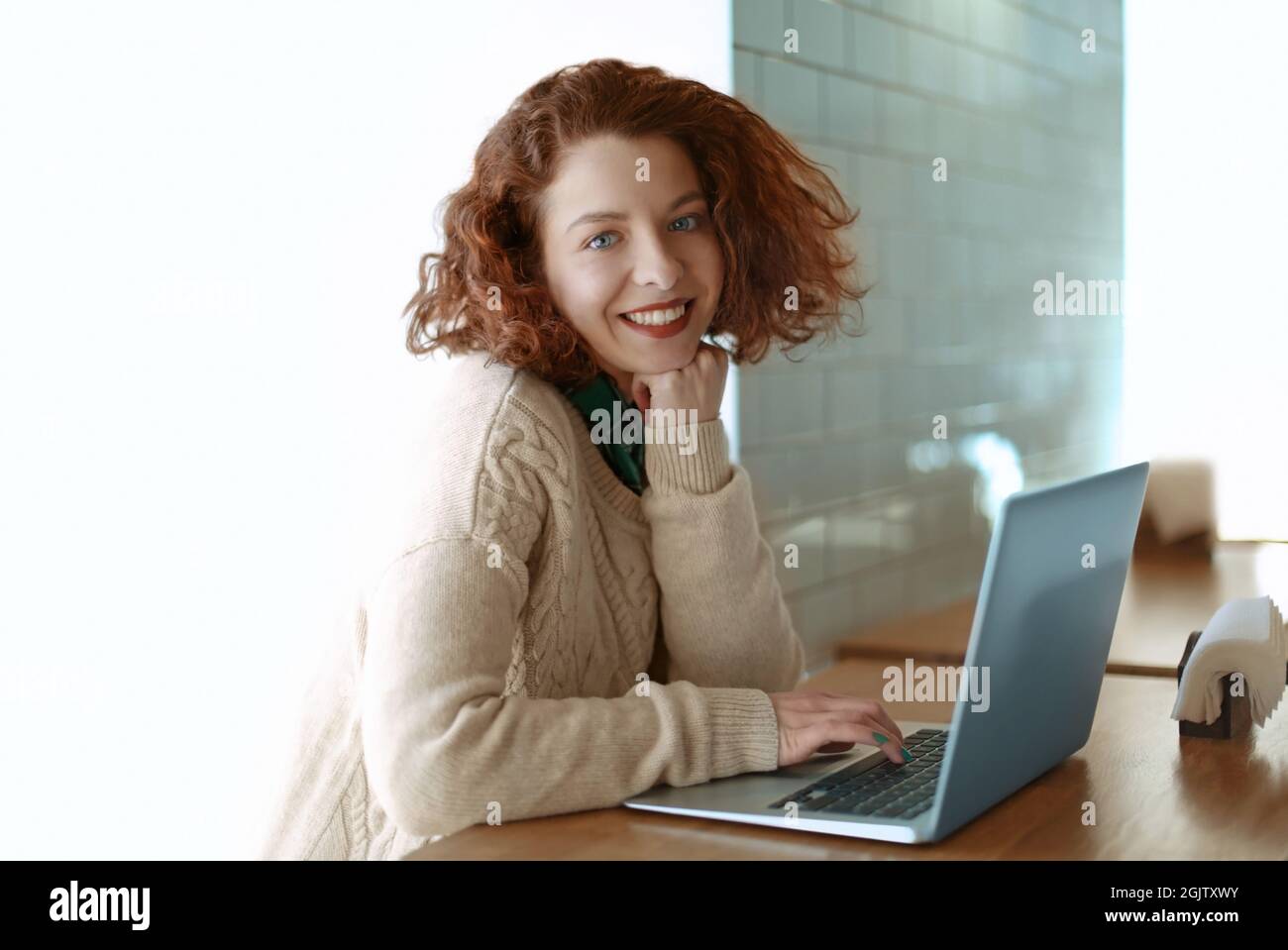 Beautiful girl with laptop in cafe Stock Photo - Alamy