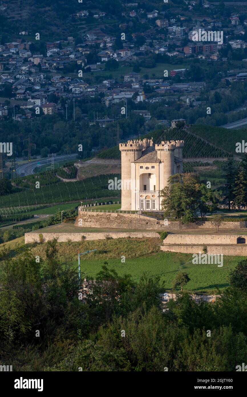 The ancient castle of Aymavilles illuminated by the last ray of sun ...