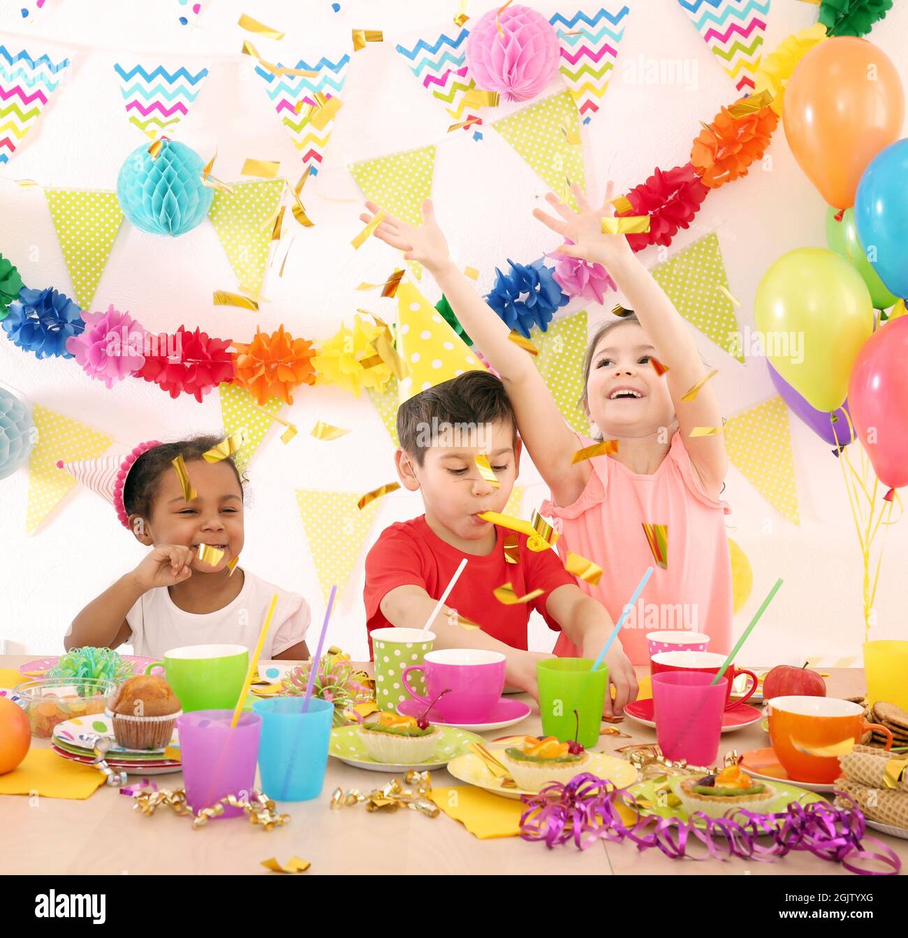 Cute little children celebrating birthday at party Stock Photo - Alamy