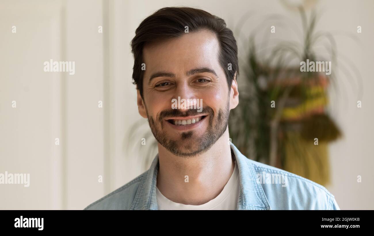 Headshot portrait of millennial guy posing smiling on camera Stock ...