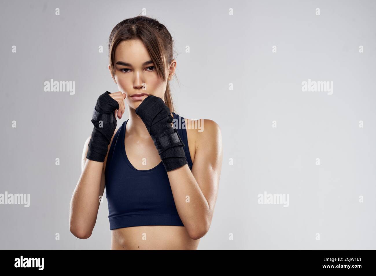 pretty woman hand bandages punch workout fighter isolated background ...