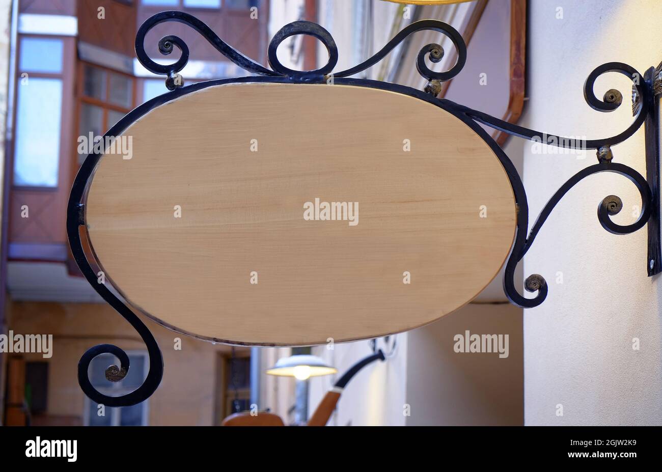 Signboard hanging on building outdoors Stock Photo - Alamy