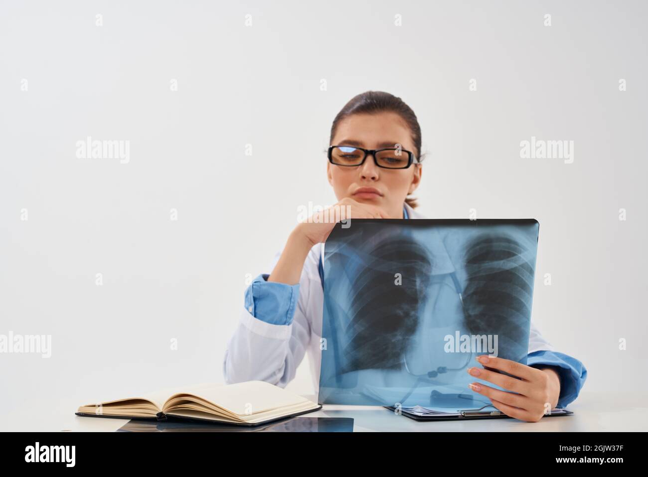 radiologist sitting at the table x-ray diagnostics treatment Stock ...
