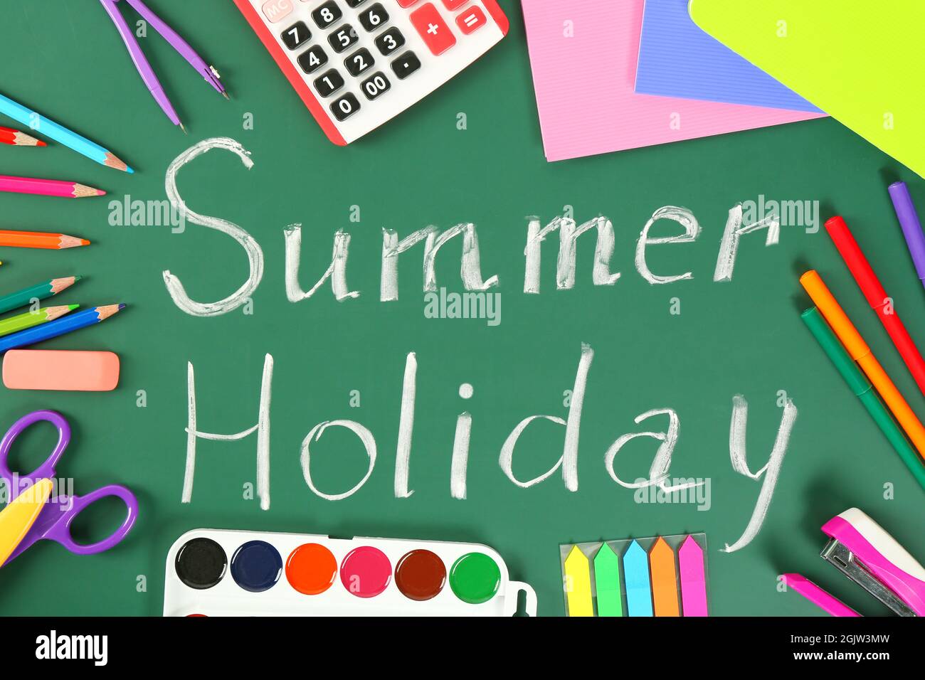 Stationery and "SUMMER HOLIDAY" text on chalkboard Stock Photo - Alamy