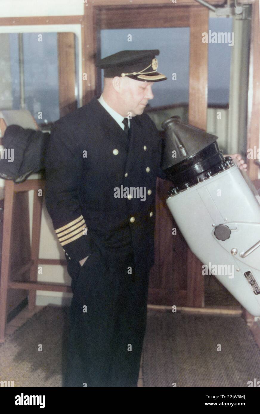 Master viewing Kelvin Hughes marine radar display unit on the bridge of ...