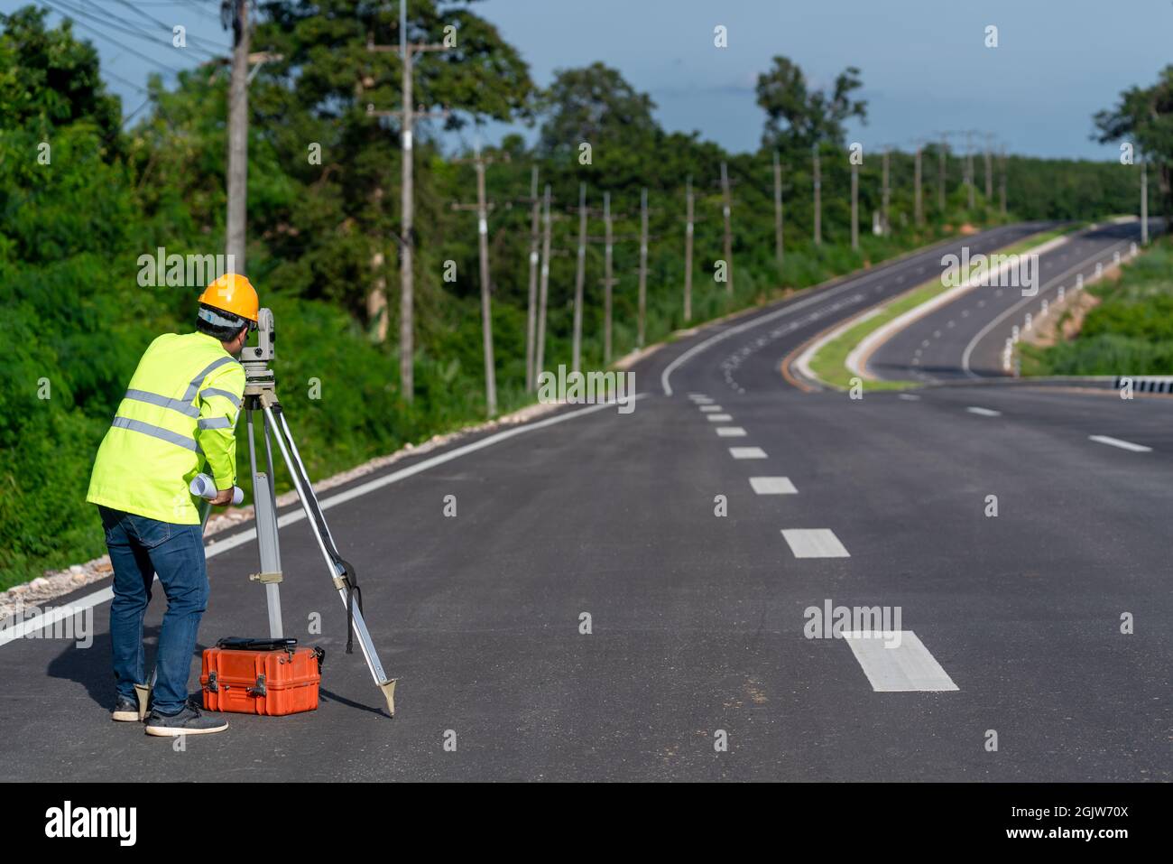 A surveyor engineer worker making measuring with theodolite instrument ...