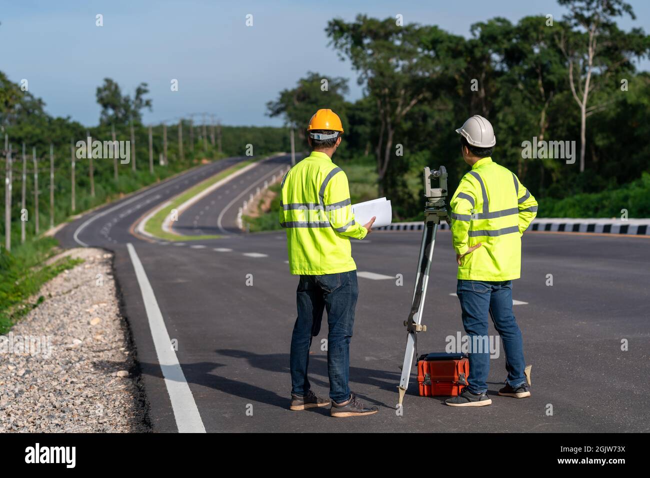 Asian surveyor engineers worker making measuring with theodolite ...