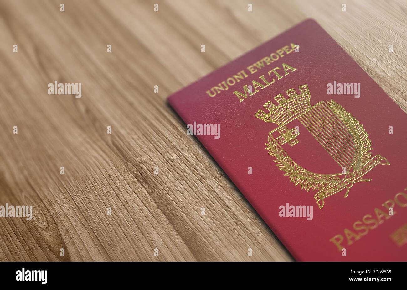 Malta passport, carried by a Maltese citizen, on a wooden floor Stock ...