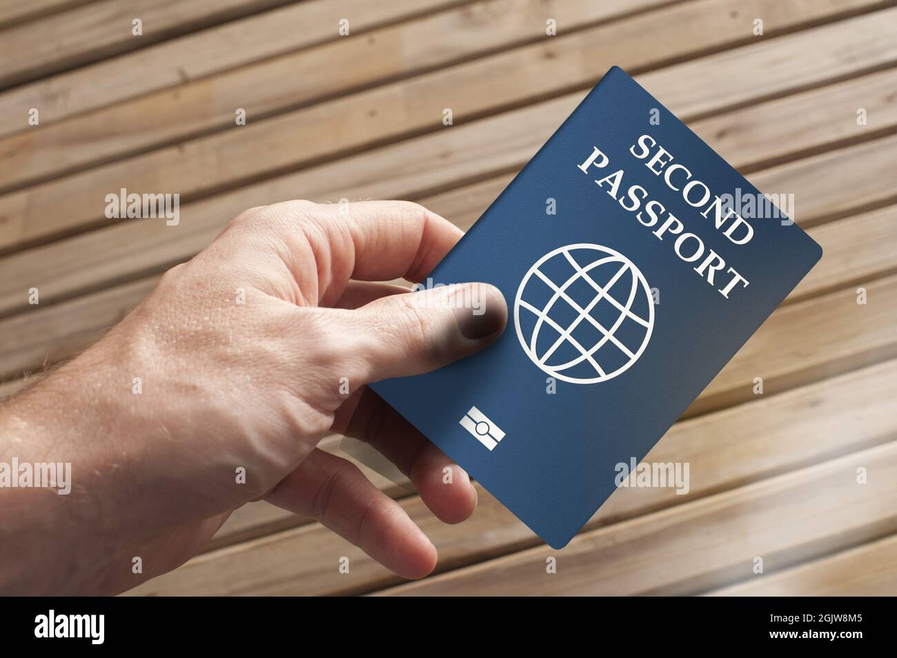 Close Up of Hand Holding passport with Wooden Slat Background Stock ...