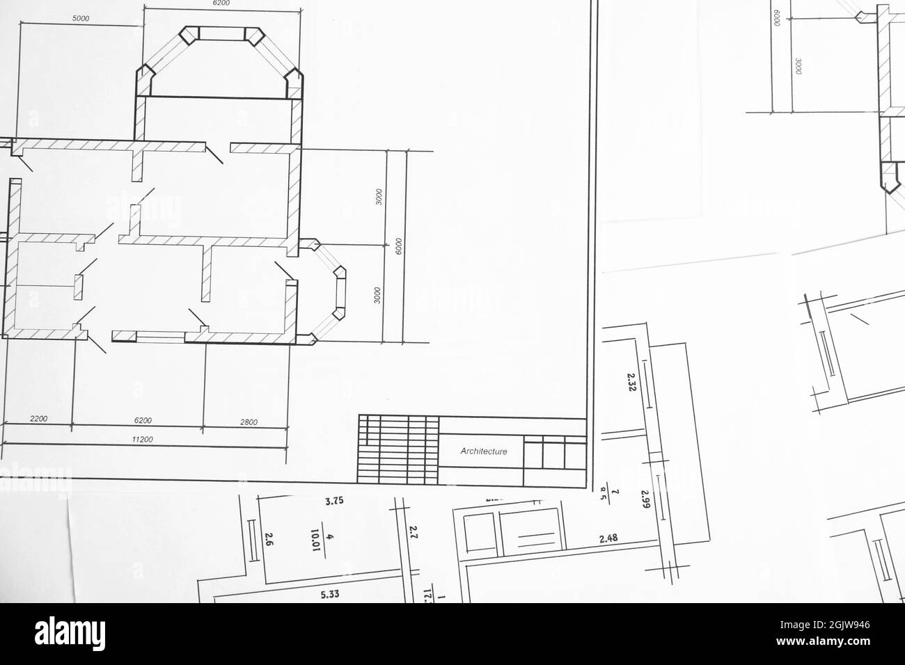 Engineering blueprints on table Stock Photo - Alamy
