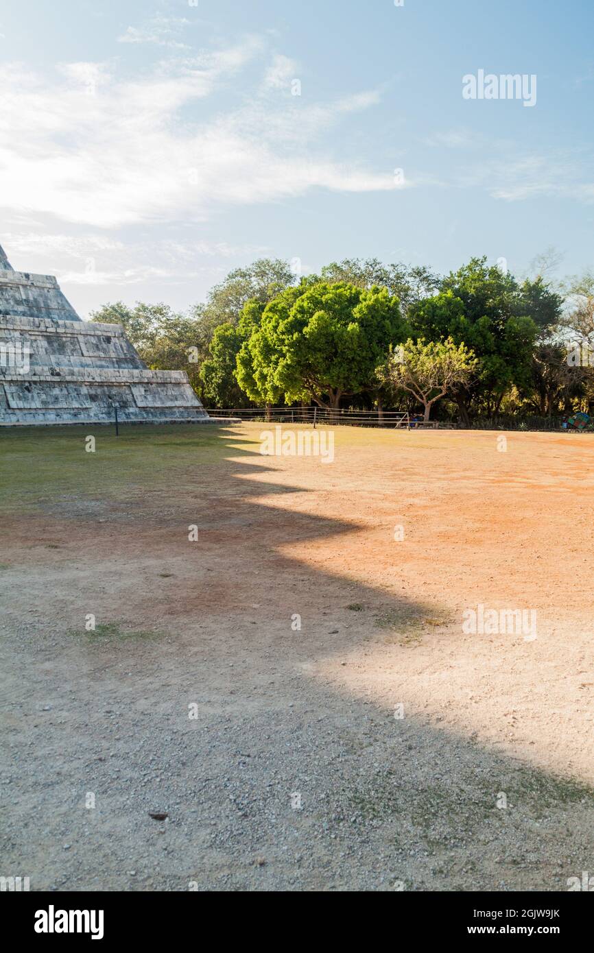 Early morning shadow of the pyramid Kukulkan in the Mayan archeological ...