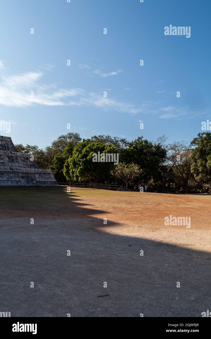 Early morning shadow of the pyramid Kukulkan in the Mayan archeological ...