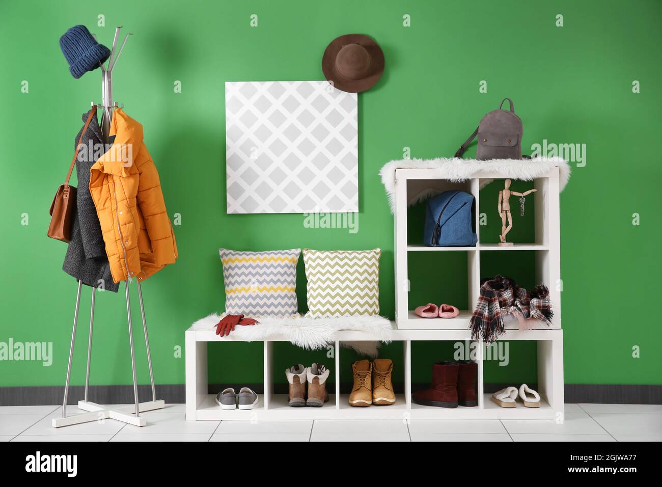 Modern hallway interior with hanging clothes Stock Photo - Alamy