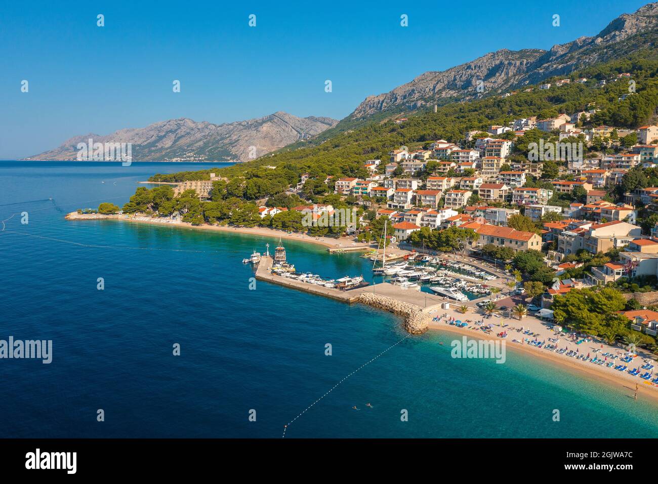 Aerial view of Brela town below Biokovo mountain, the Adriatic Sea ...