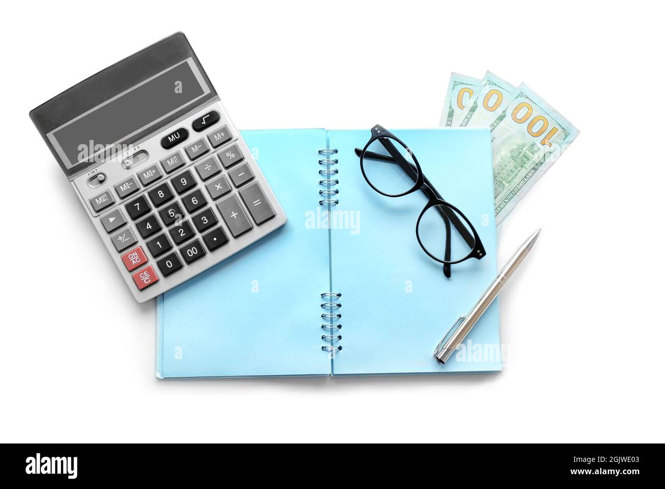 Gray calculator and notebook on white background Stock Photo - Alamy