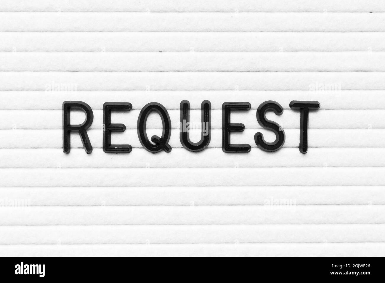 Black letter in word request on white felt board background Stock Photo ...