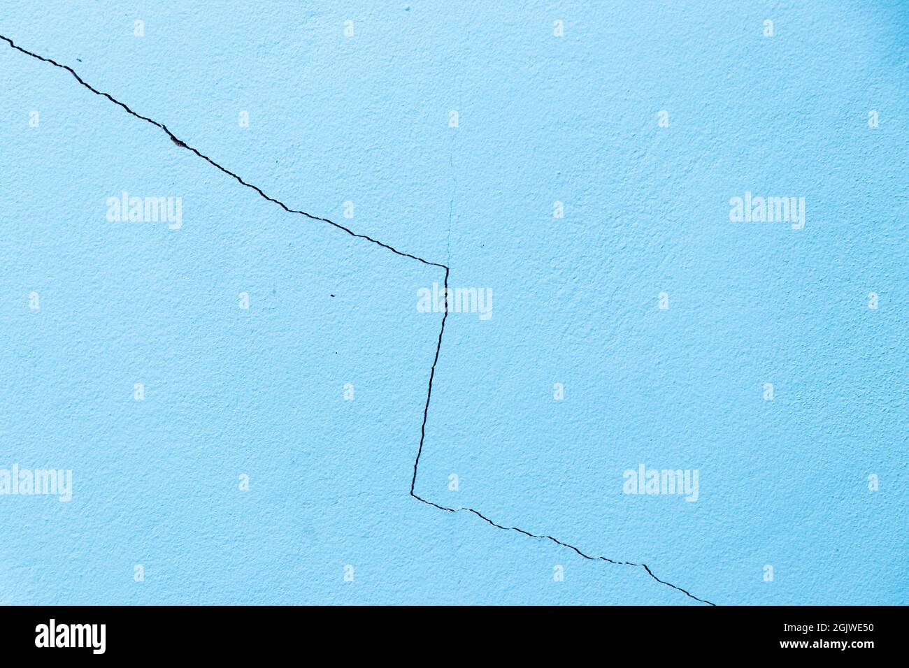 Blue color cracked concrete wall textured background Stock Photo - Alamy