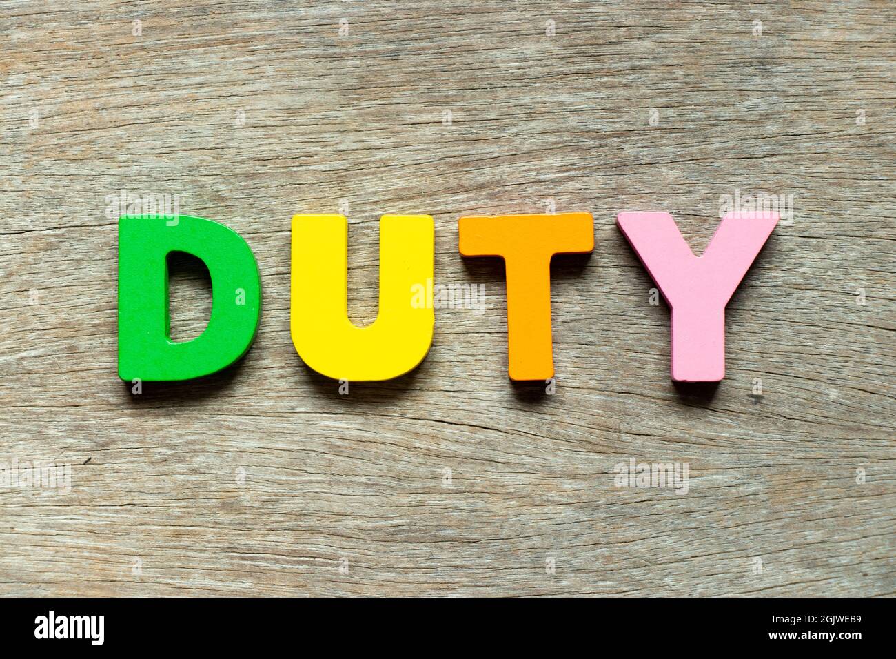 Color alphabet letter in word duty on wood background Stock Photo - Alamy