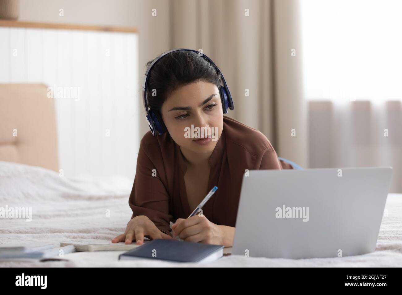 Laptop female teenage bed hi-res stock photography and images - Alamy