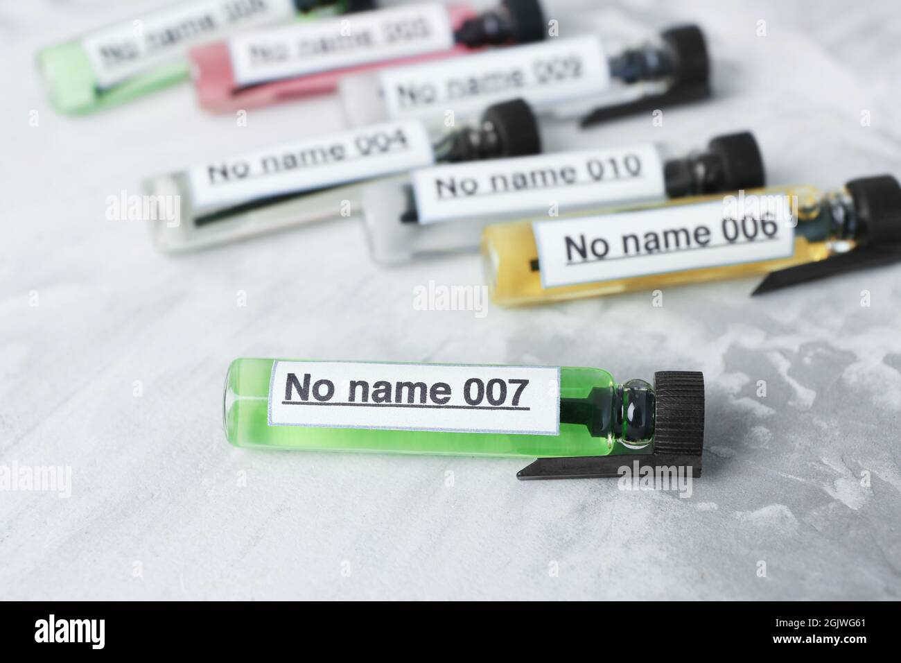 Perfume samples on light background Stock Photo - Alamy