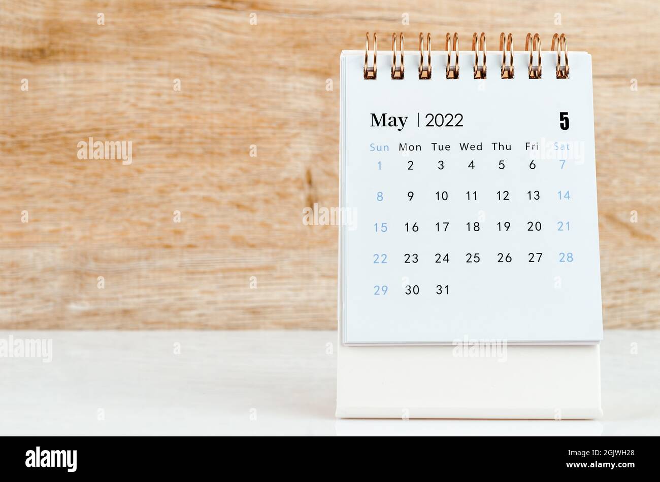 May desk Calendar 2022 on wooden table background Stock Photo - Alamy