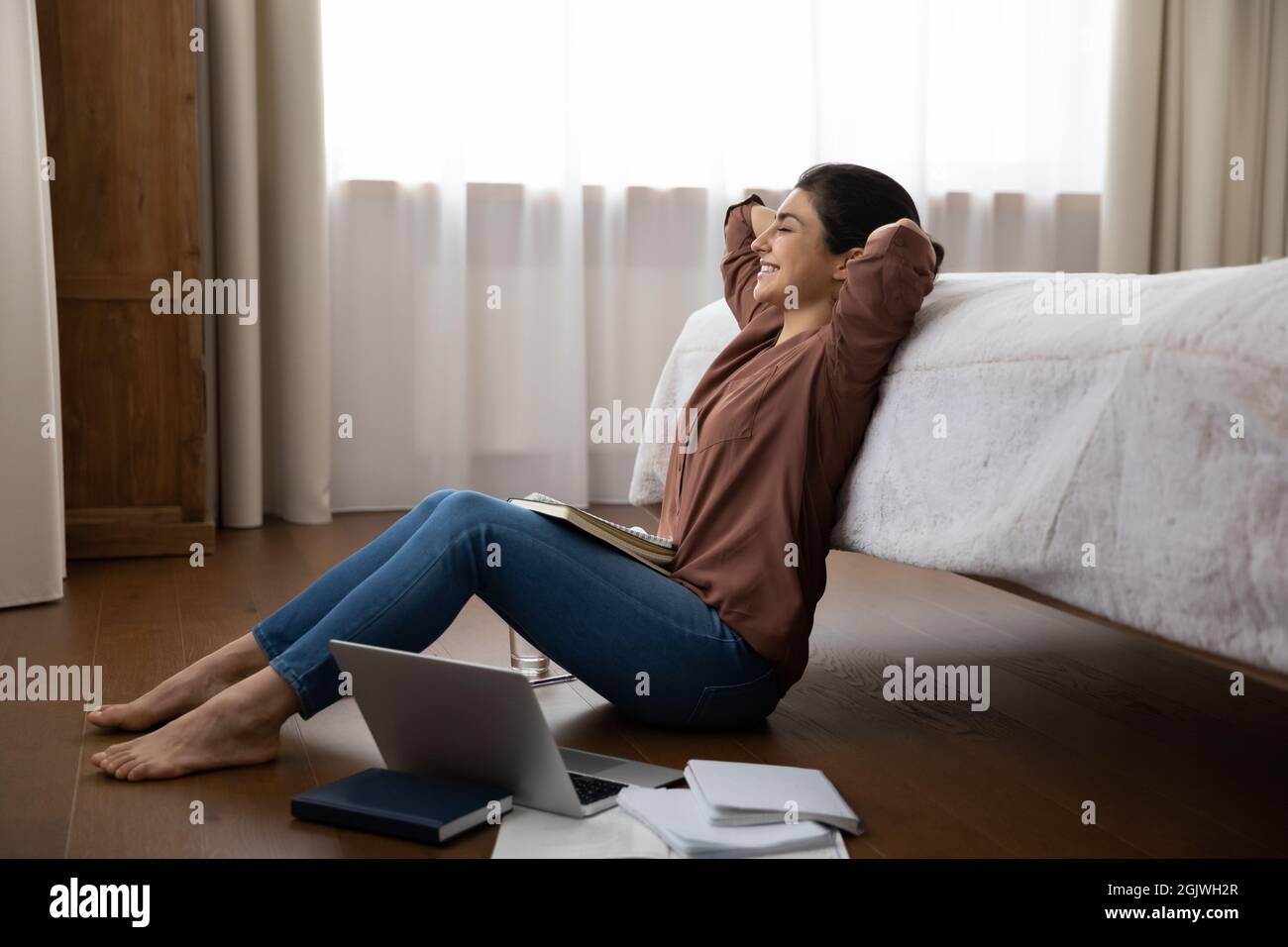 Young indian lady working at home make pause to relax Stock Photo - Alamy