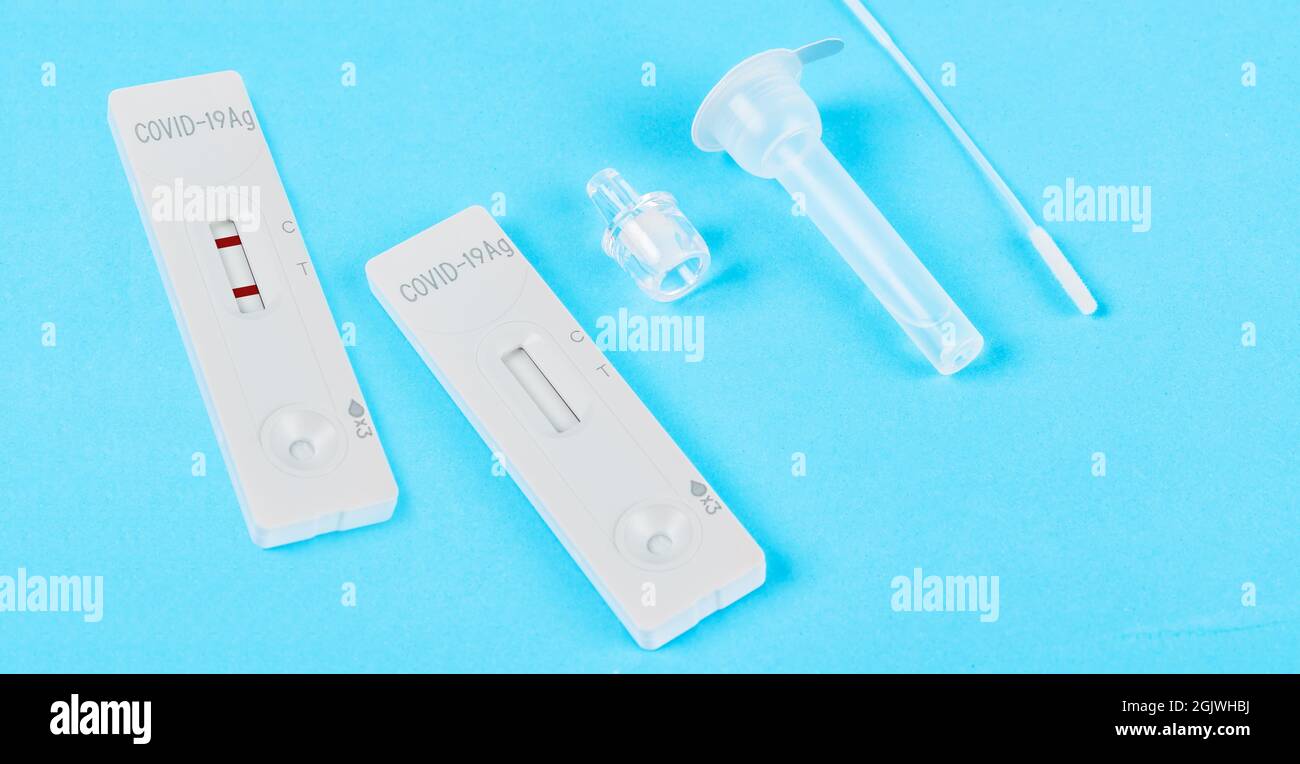 Rapid kits of Covid-19 Ag test seen on blue background Stock Photo - Alamy