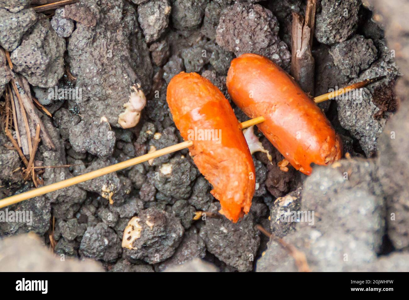 Roasting sausages at the lava field of Pacaya volcano, Guatemala Stock ...