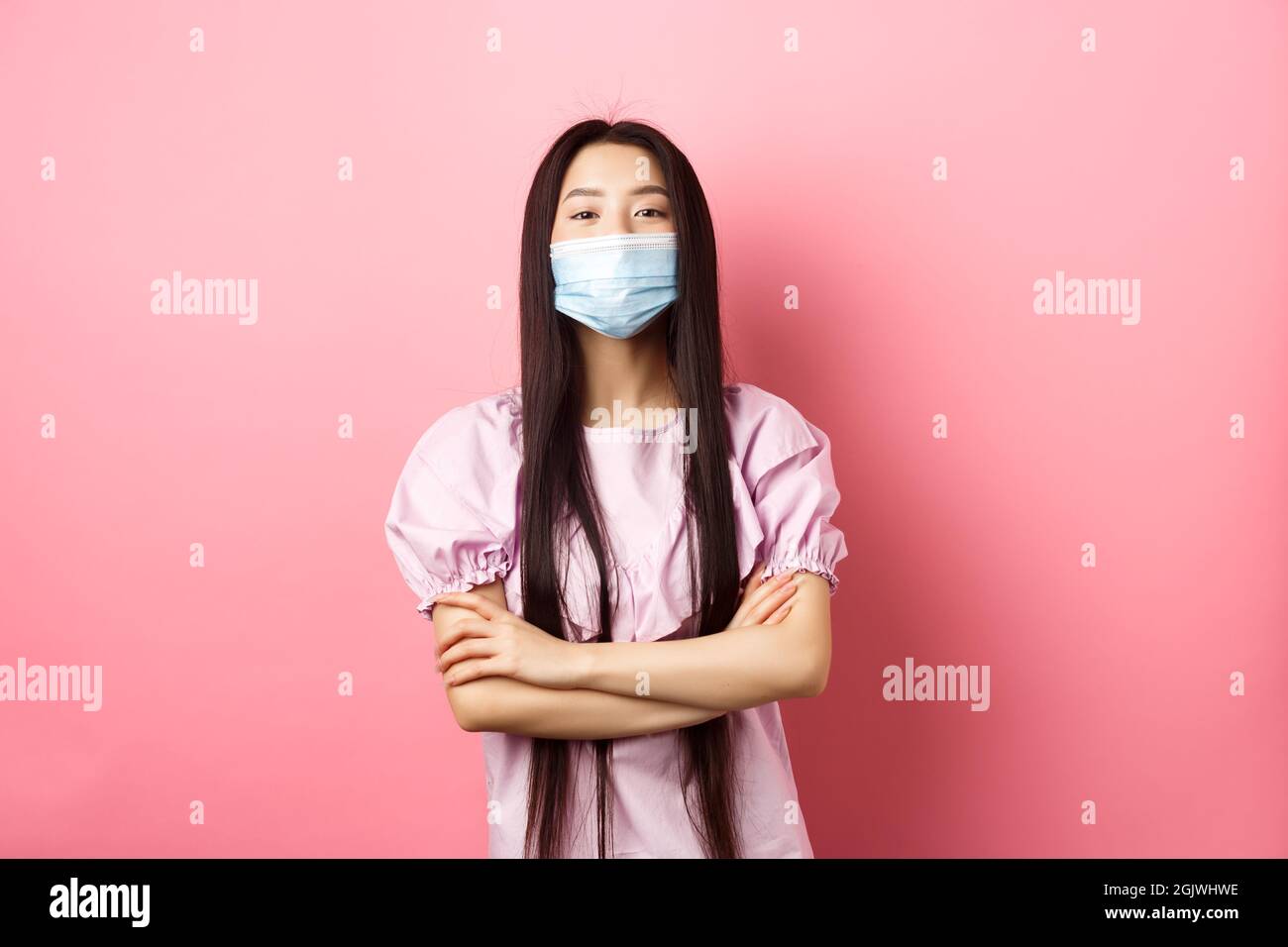 Covid-19, pandemic lifestyle concept. Cute asian woman in medical mask ...
