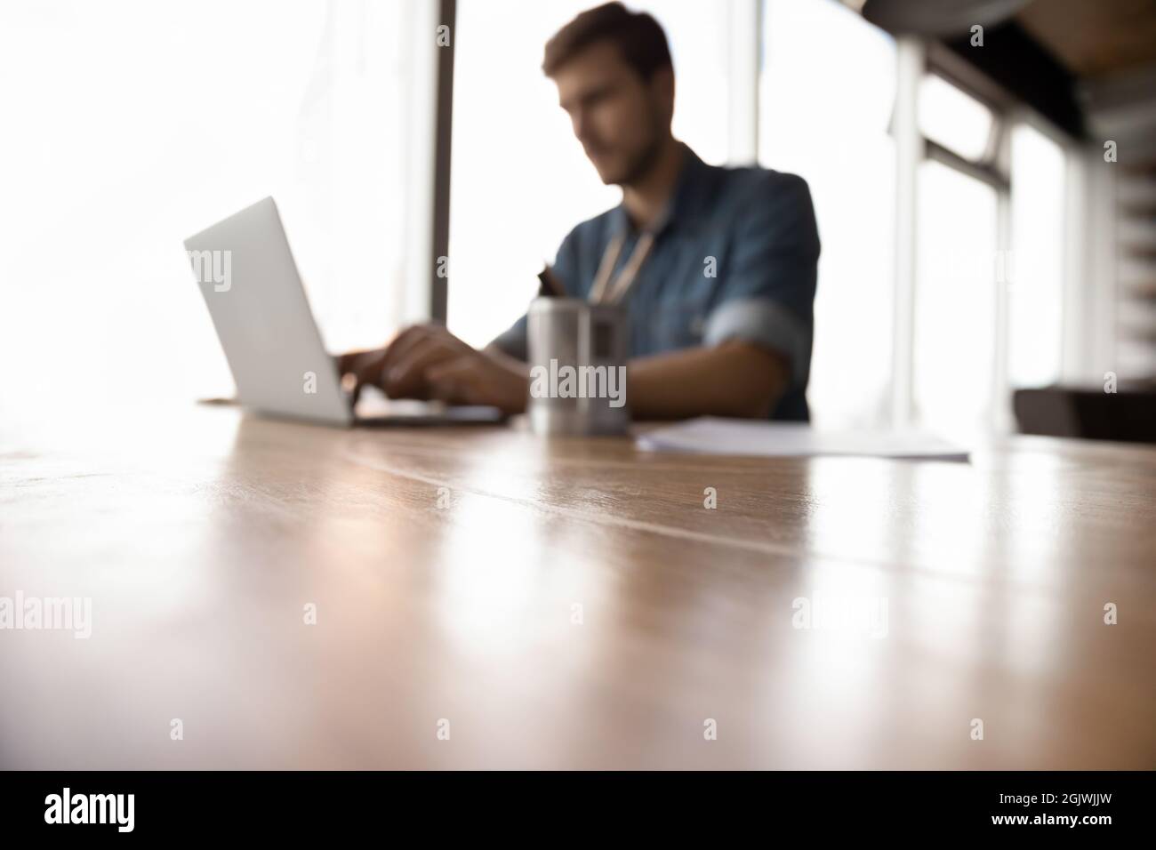 Low angle view of a blurred male cyclist on countryside track Stock ...