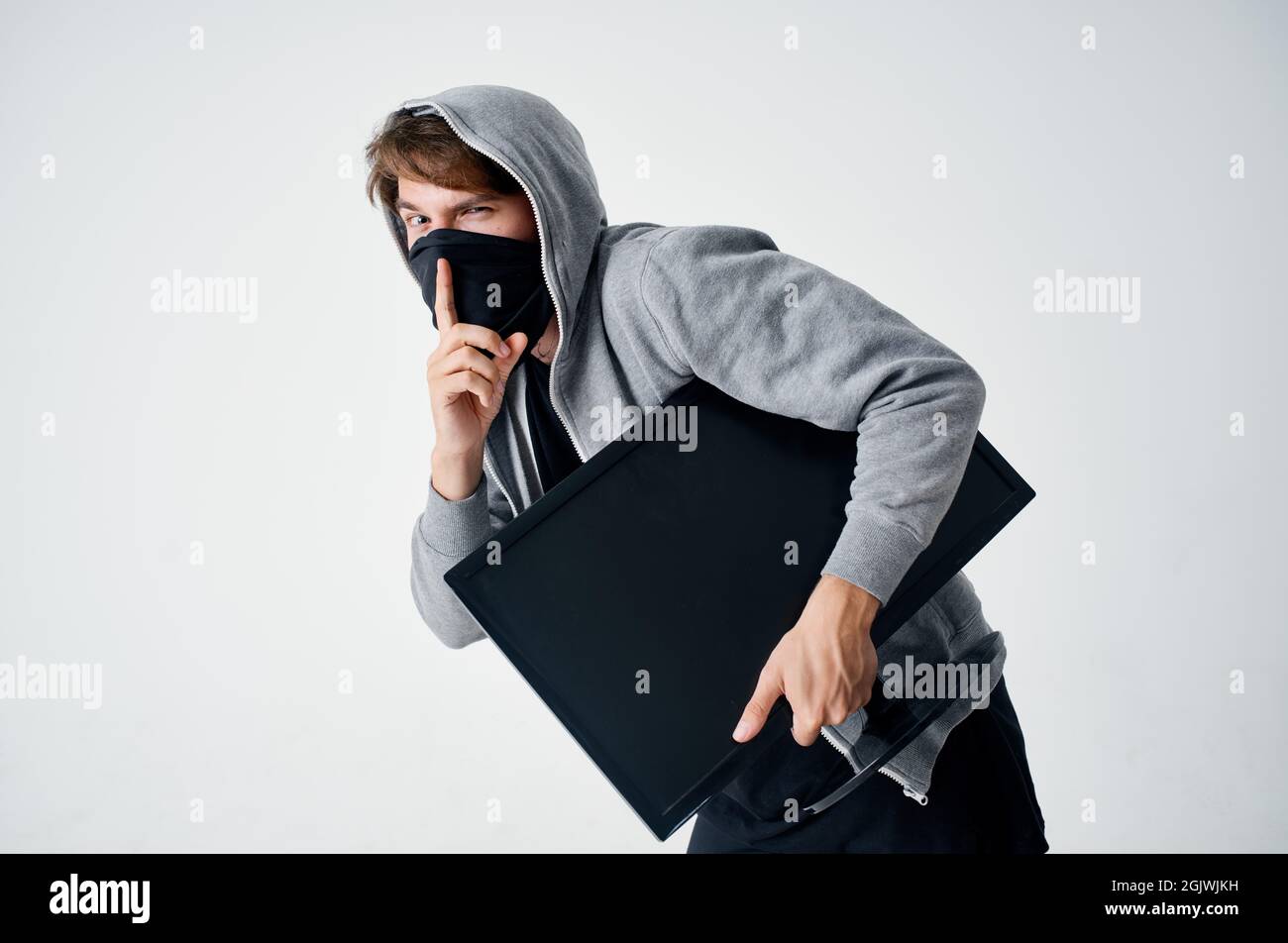 hacker stealth technique robbery safety hooligan light background Stock ...