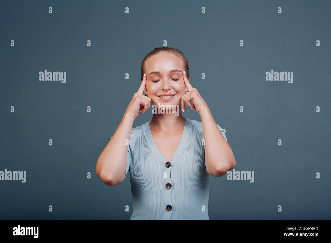 Adult young woman smile positive think portrait in studio Stock Photo ...