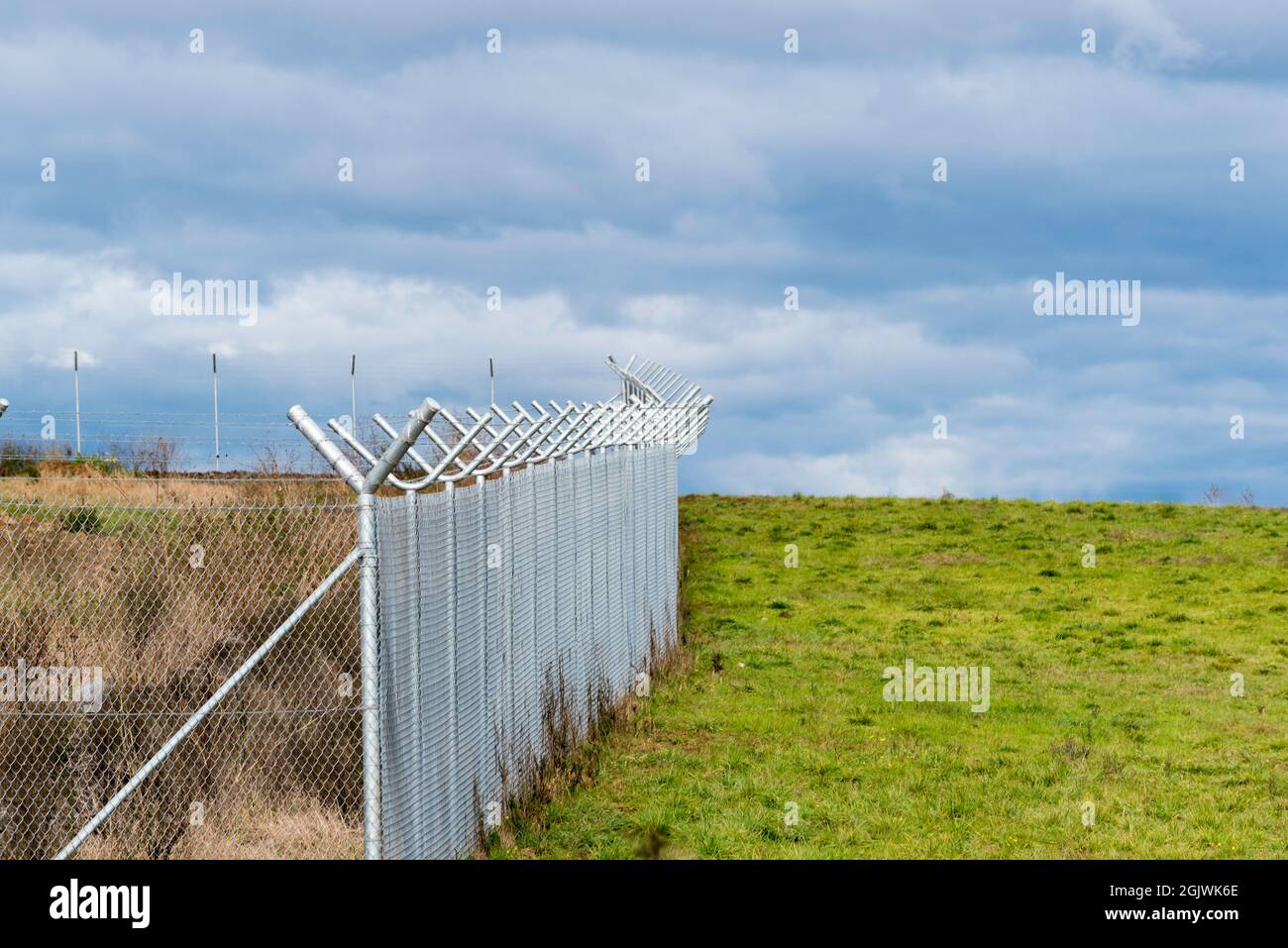 Grey skies and a high security perimeter fence surrounds par of the new ...