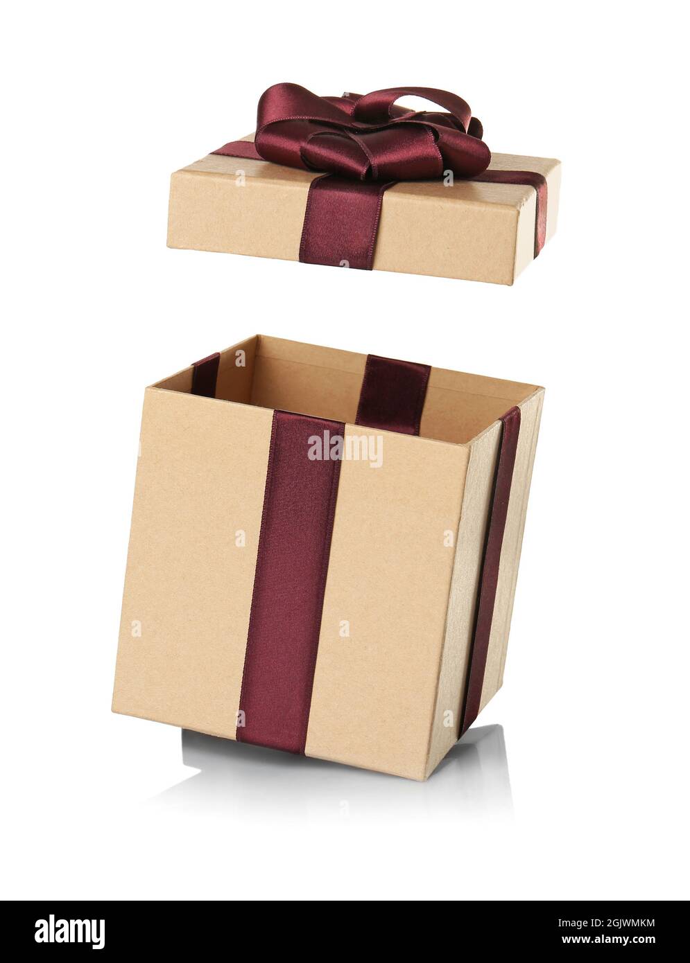 Open beige gift box with vinous ribbon on white background Stock Photo ...