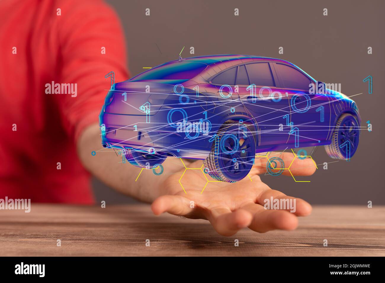 A blue digital car above a hand Stock Photo - Alamy