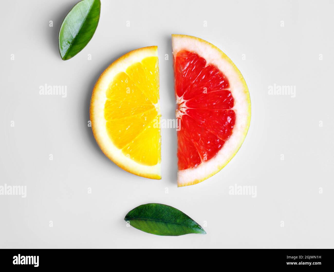 Composition of fresh slices of citrus fruits on white background Stock ...